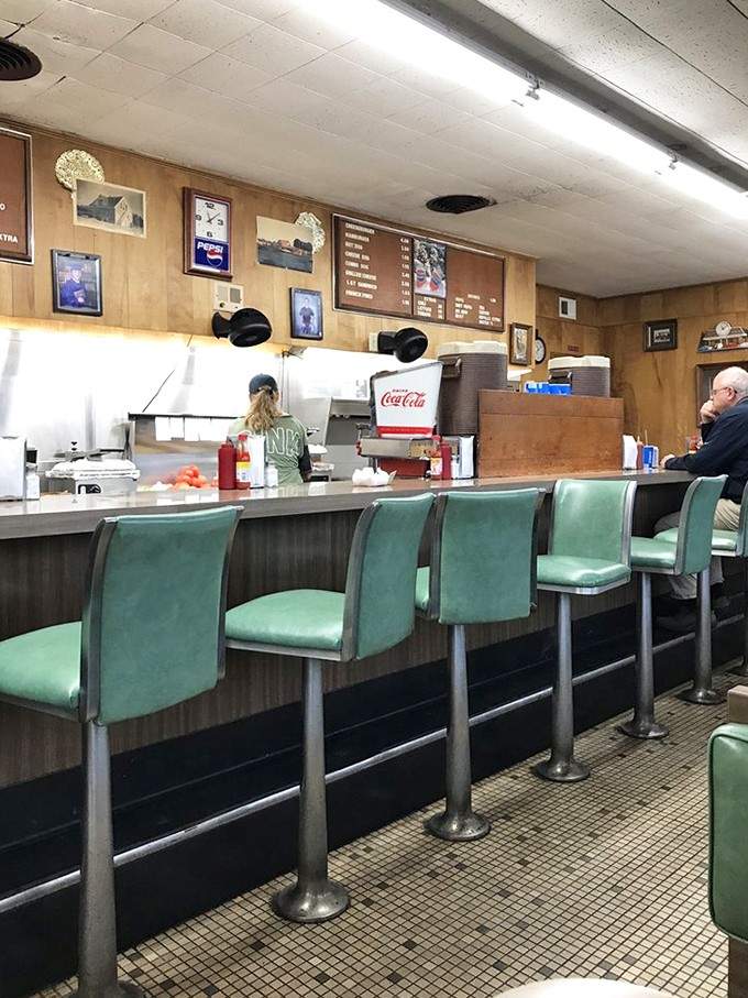 Step inside and feel decades of satisfied customers soaking into those authentic wood-paneled walls.