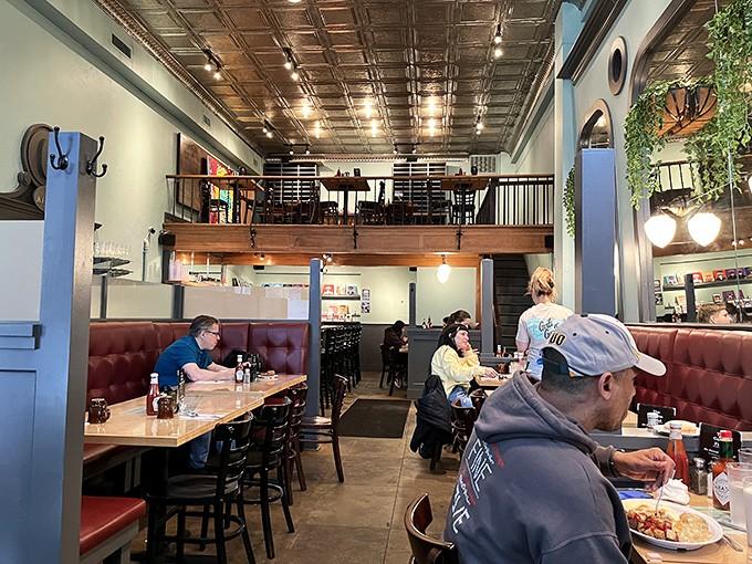 Step inside and discover a warm embrace of comfort food culture, complete with cozy booths and community vibes.