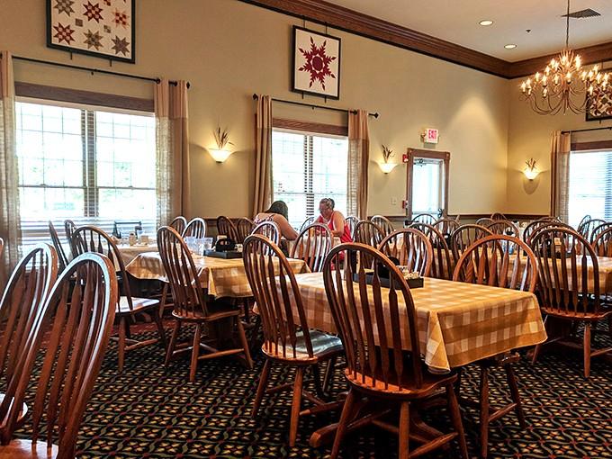 Step inside where quilted wall art and warm chandeliers create the perfect setting for serious comfort food conversations.
