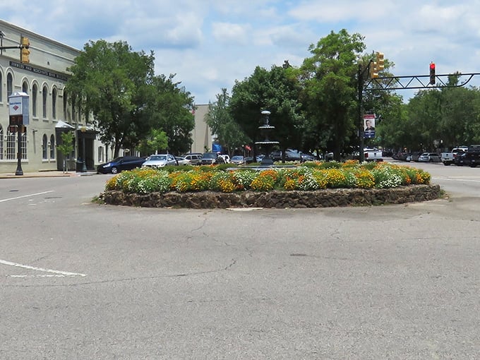 Small-town charm blooms eternal in Aiken, where flower-filled roundabouts remind us that beauty thrives in simplicity.