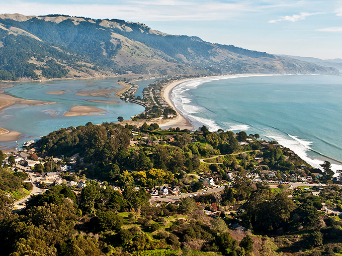 Bolinas sits tucked away like California's best-kept secret, where colorful homes peek through lush green trees.
