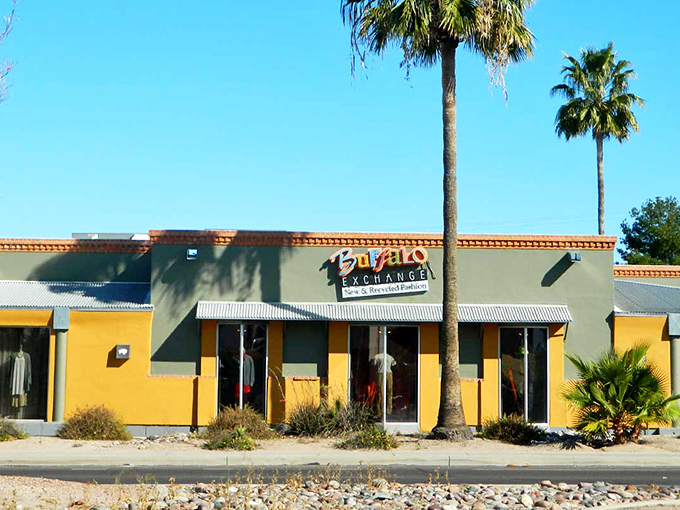 Buffalo Exchange's sunny yellow exterior and palm trees create the perfect Arizona vibe for stylish secondhand shopping adventures.