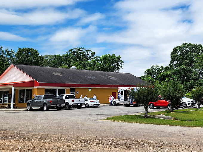 Carter's Fried Chicken hides in plain sight, a humble yellow building where culinary magic happens daily. No frills, just thrills.
