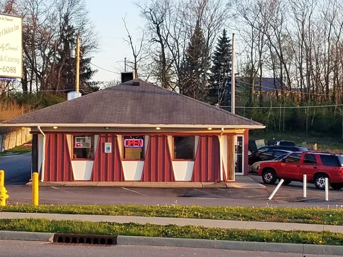 This striped roadside gem proves that the most colorful buildings often serve the most memorable fried chicken.