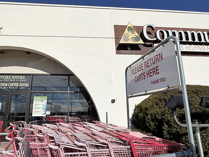CommunityAid's shopping cart brigade stands at attention, ready for your thrifting adventure. Red carts, red-hot deals!