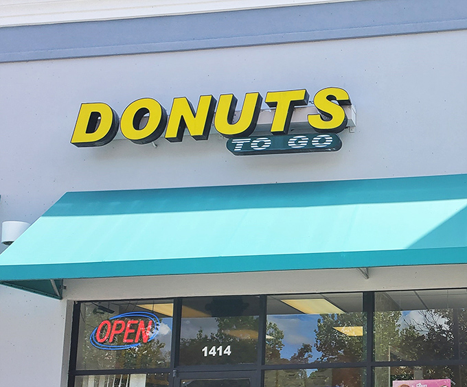 Simple sign, extraordinary donuts. This unassuming shop proves greatness doesn't need fancy packaging.