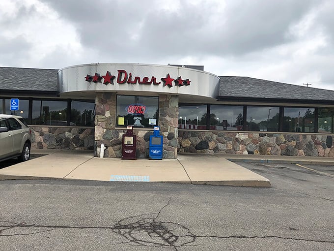 Flag City Diner's stone facade and red star signage&mdash;where patriotism meets pancakes in perfect harmony.