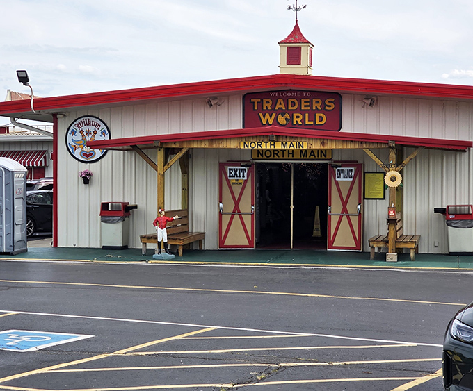 Welcome to Traders World, where that cheerful red barn facade promises adventures in organized chaos within.