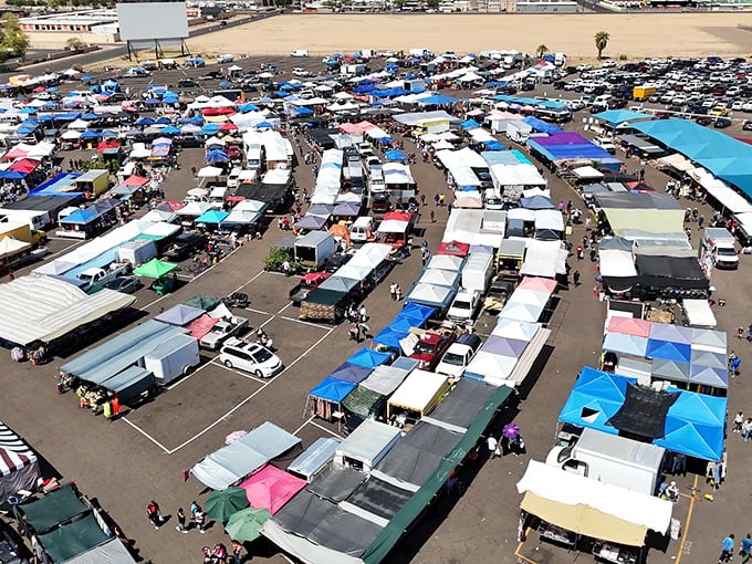 From above, this swap meet looks like a giant patchwork quilt of colorful canopies sheltering countless treasures below.