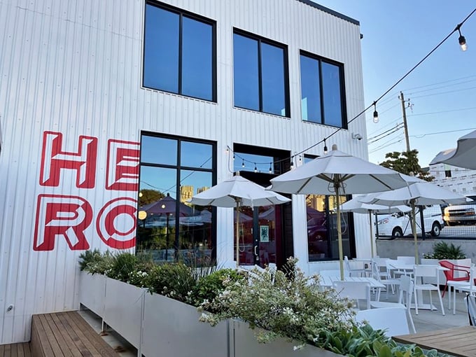 HERO's sleek white building with outdoor seating looks more like an art gallery than a donut shop. Plot twist: the art is edible!