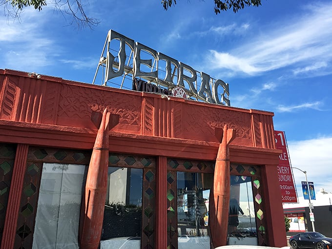 Jet Rag's iconic red building stands out like a vintage ruby in LA's urban landscape.