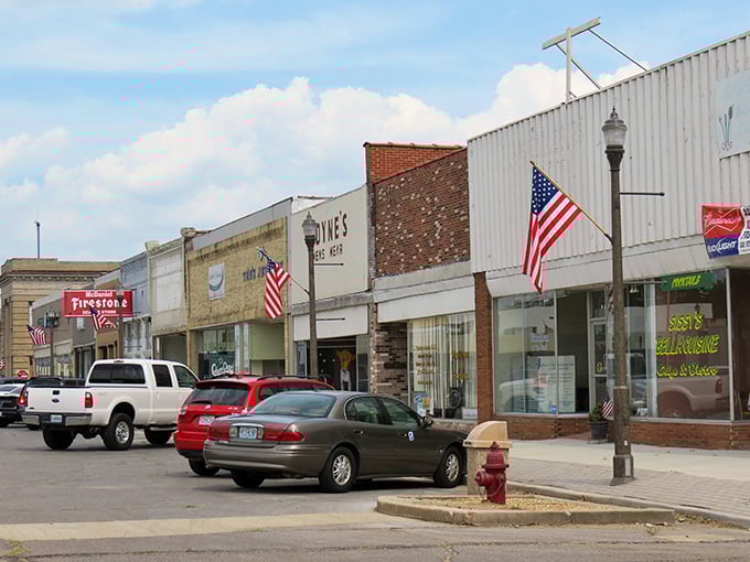 Small-town storefronts line up like old friends, each one ready to welcome you home again.