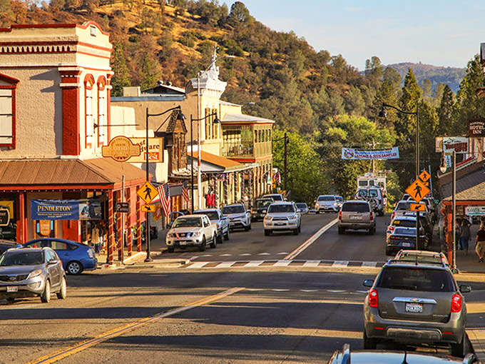 The warm glow of sunset on Mariposa's storefronts &ndash; where history meets small-town hospitality just minutes from Yosemite.