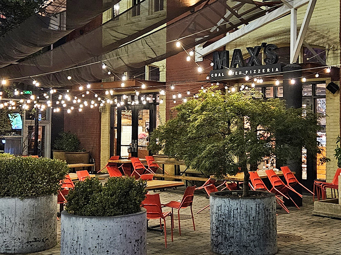 Picture a romantic comedy set in Italy - that's Max's outdoor seating where string lights create pure magic.
