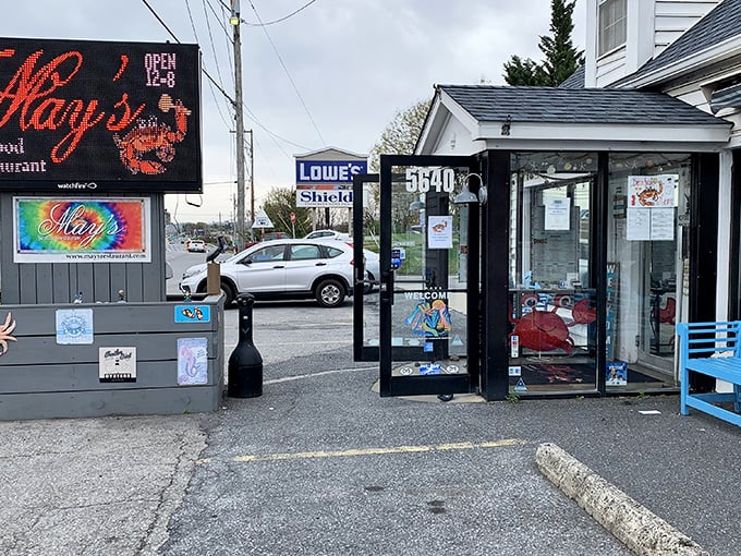 Strip mall exterior, but that neon crab sign promises treasures worthy of any coastal expedition.