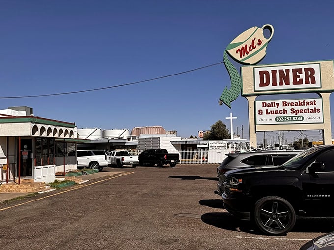 That vintage coffee cup sign practically screams "pull over for pancakes" in the best possible way.