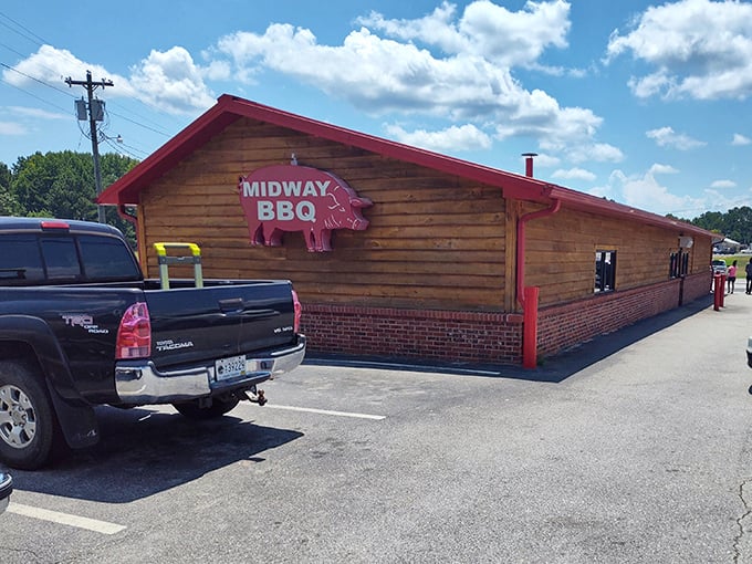 Midway BBQ's wooden fortress of flavor stands proud with its pig sign announcing serious barbecue business.