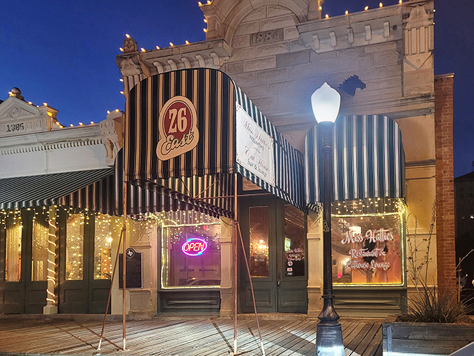 Miss Hattie's green-striped awnings glow at twilight. This historic 1884 building has seen more Texas tales than a Willie Nelson songbook.