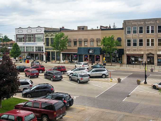 This downtown square buzzes with gentle energy, where parking is plentiful and conversations happen naturally between neighbors.