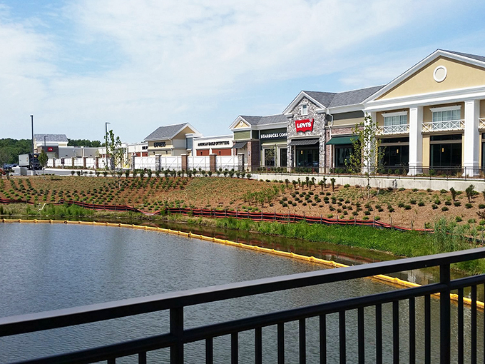 Norfolk Premium Outlets offers waterfront shopping with stylish storefronts reflecting in the peaceful pond. Retail therapy with a view!