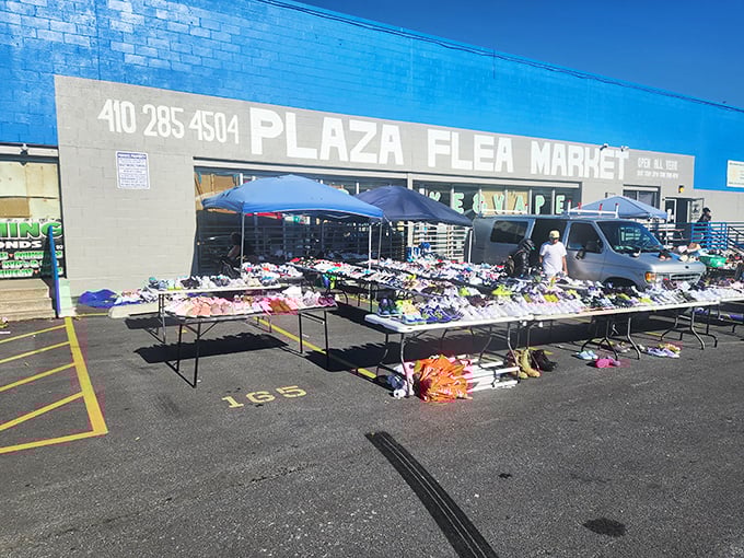 The iconic blue building beckons! North Point Plaza's vibrant marketplace offers everything from sneakers to stereos under one sky.