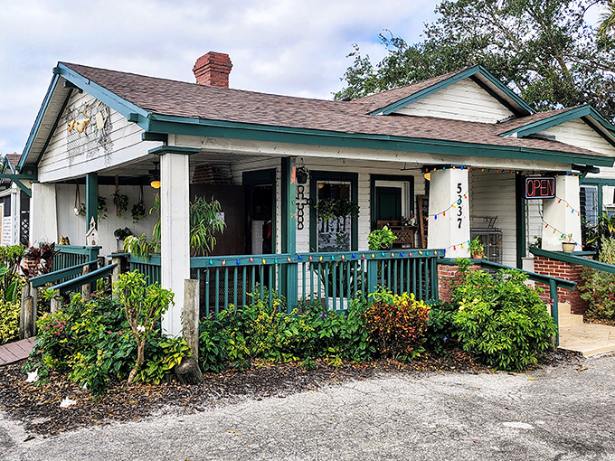 Peace River Seafood's charming cottage exterior promises the kind of home-cooked seafood that makes you want to hug the chef.