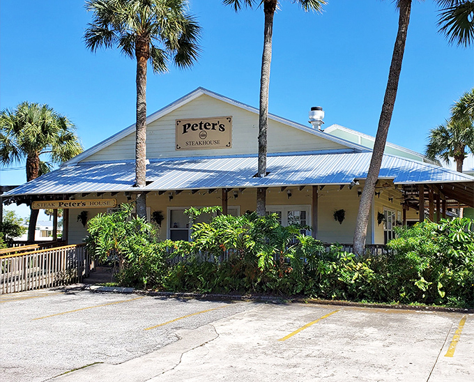 Beach cottage meets meat palace! Peter's Steakhouse looks like it should be selling seashells, but those palm trees are guarding some serious beef territory.