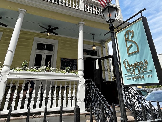 Poogan's Porch exudes classic Charleston charm with its yellow Victorian facade and inviting front porch. Southern hospitality in building form!