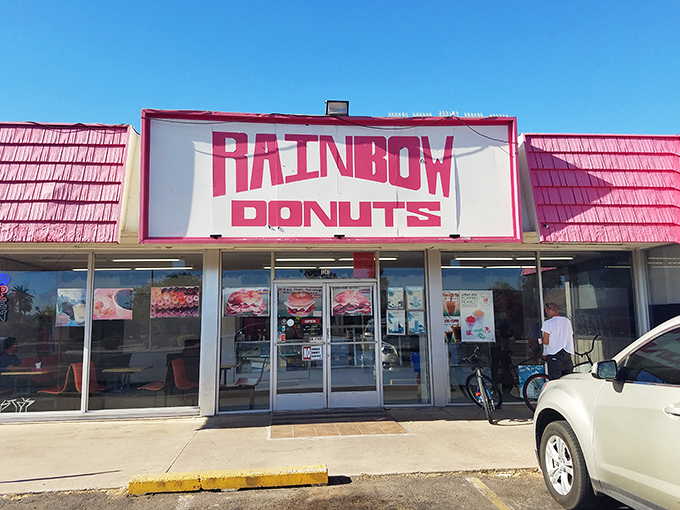 Rainbow Donuts wears its heart on its sleeve with that bold, colorful storefront display. 