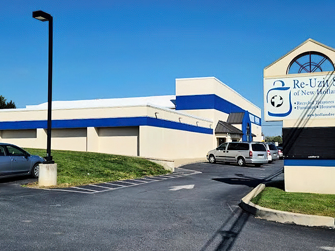 Re-Uzit Shop's clean blue and white exterior hints at the organized bargain paradise waiting inside.