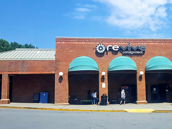 Those elegant green awnings whisper "quality consignment" louder than a town crier with megaphone.