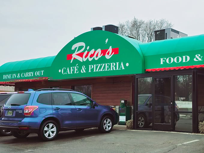 Rico's green awning beckons like a beacon for hungry travelers seeking authentic Italian comfort in small-town Michigan.