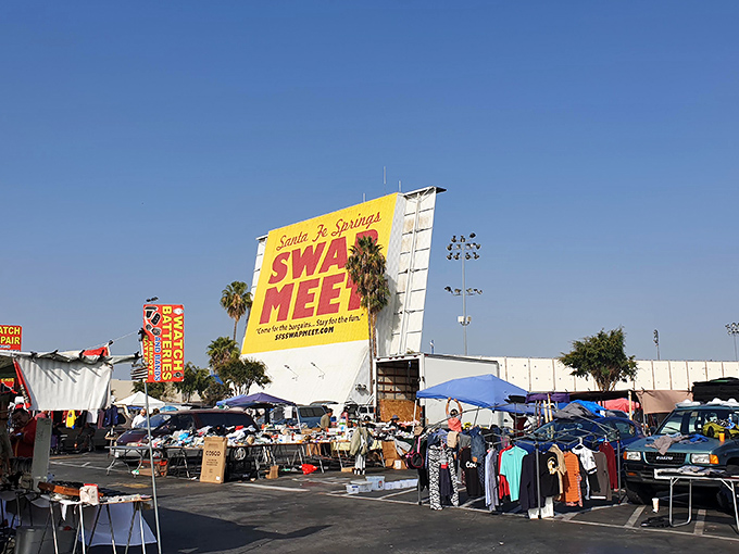 That giant yellow sign isn't kidding around. Santa Fe Springs Swap Meet spreads out under perfect California skies, promising deals as endless as the sunshine.