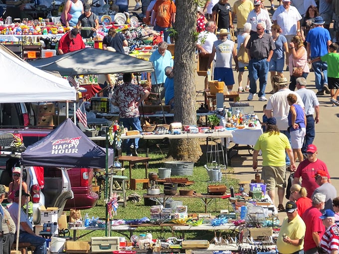The outdoor bazaar buzzes with energy as shoppers weave through endless vendor booths.