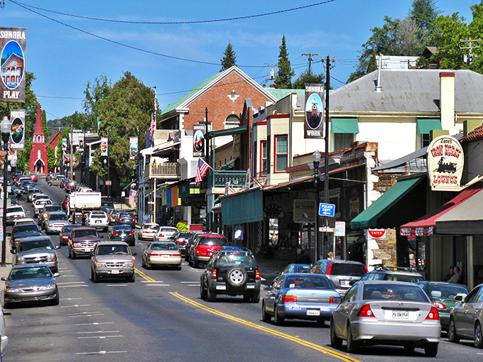 Traffic jam, Gold Rush style! Sonora's sloping main drag showcases a colorful parade of storefronts where history and commerce dance together under California sunshine.
