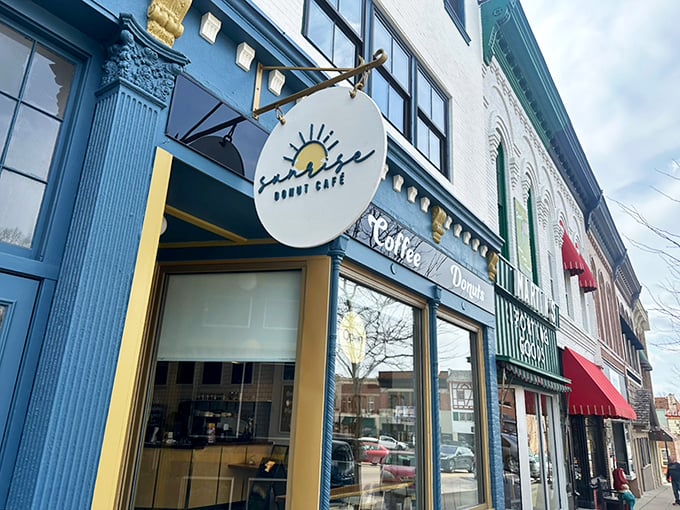Sunrise Donut Caf&eacute;'s blue storefront brings a pop of color to Monroe's main street, promising morning magic inside.