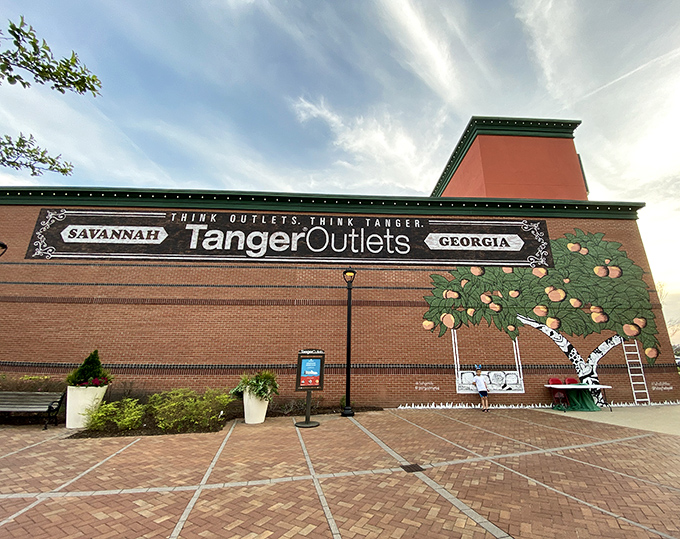 This charming brick facade whispers Southern hospitality while those peach murals practically sing "Georgia on My Mind" in living color.