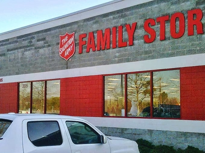 The distinctive red and gray exterior of The Salvation Army Family Store stands out like a beacon for bargain hunters in Raleigh. Their iconic shield logo means quality finds await inside!