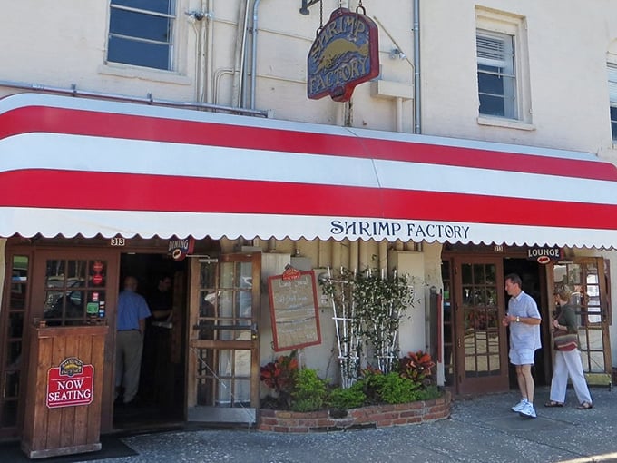 The Shrimp Factory's iconic red and white awning on River Street &ndash; like a lighthouse guiding hungry souls to seafood salvation.