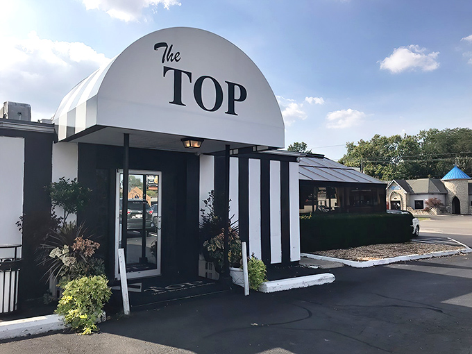 Those bold black and white stripes aren't just for show - they're advertising confidence in what's sizzling behind those doors.