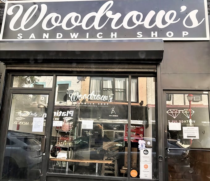 Woodrow's sleek storefront promises sandwich artistry within. The kind of place that turns lunch into an event worth savoring.