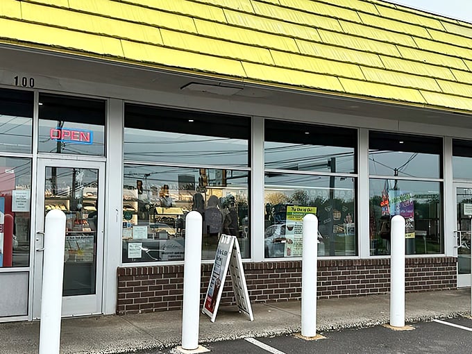 That cheerful yellow exterior practically shouts "happiness lives here" to every passing sweet tooth.