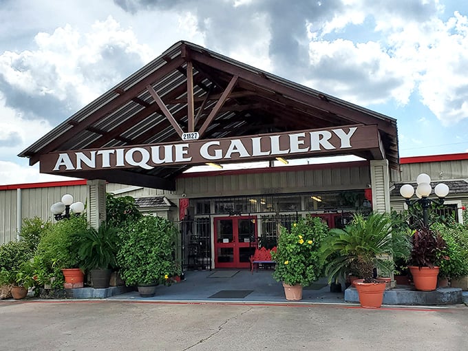 Surrounded by lush greenery, this antique hunter's paradise stands ready for exploration. The red doors practically whisper, "Come find something wonderful!"