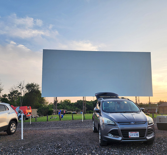 Evening light paints the sky as families claim their spots for tonight's double feature adventure.