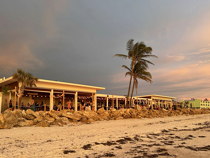 Rock formations and palm trees frame this beachfront gem where every seat feels like winning the lottery.