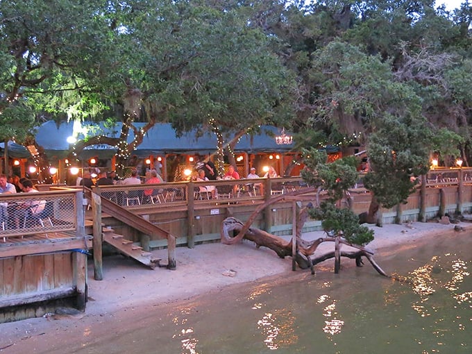 When twilight hits, the string lights twinkle like fireflies above diners at Cap's, where the Intracoastal becomes both backdrop and dinner companion.