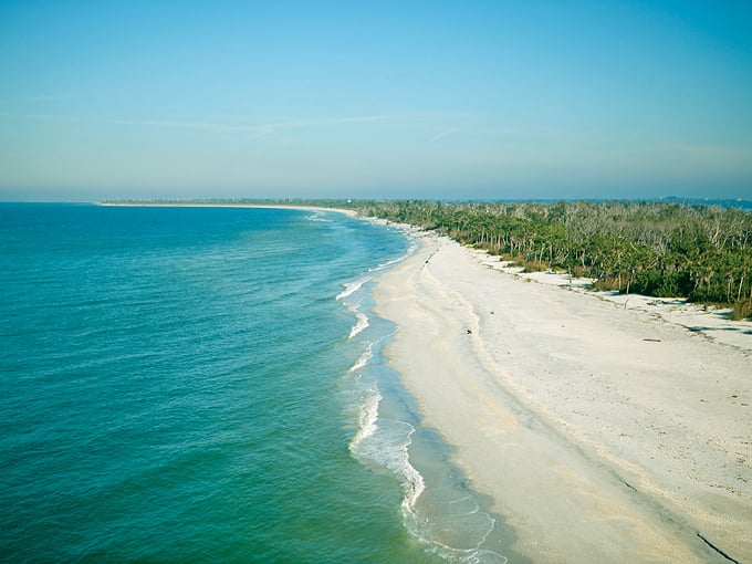 Miles of untouched beach stretch endlessly, proving paradise still exists in our backyard.