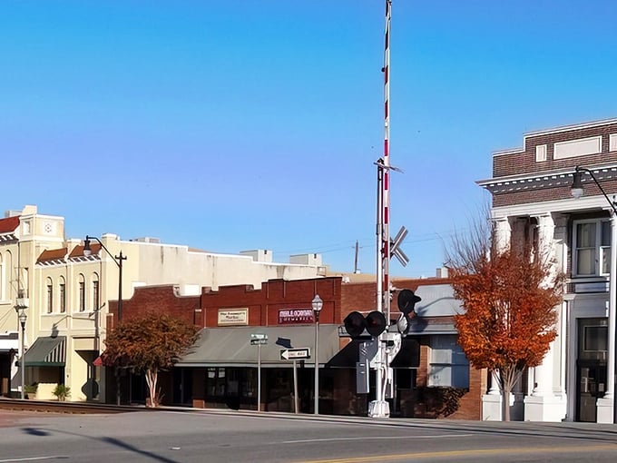 Main Street stretches ahead with the promise of affordable living, where railroad tracks remind you of simpler times.