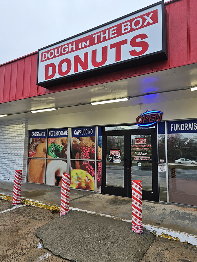 The sign says it all - simple, straightforward, and promising exactly what you need: DONUTS. No frills, just thrills for your taste buds.