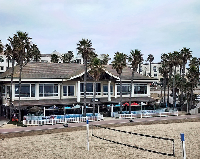 Beachfront bliss where every table offers front-row seats to Huntington's endless summer show.